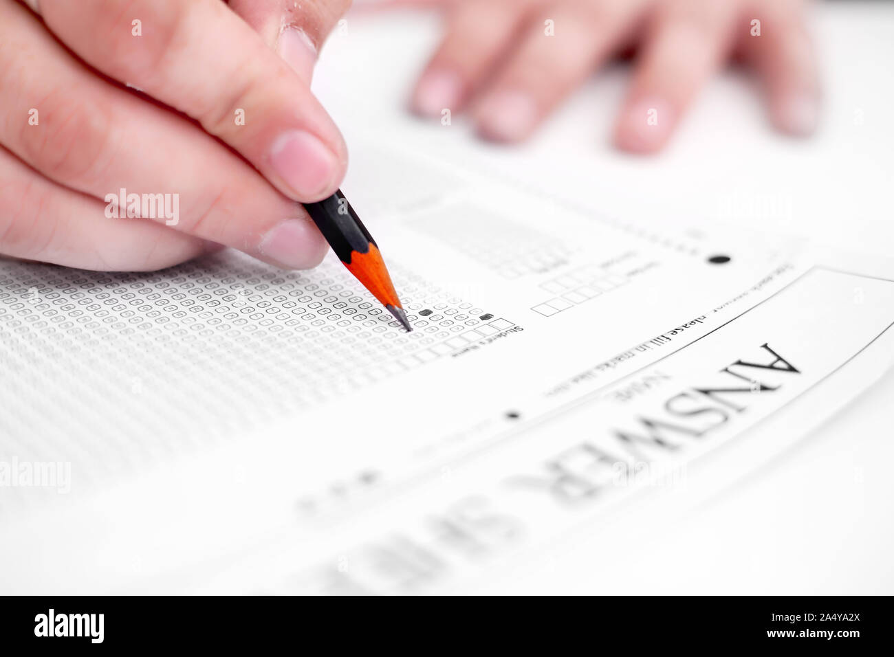 Picture of a man filling the OMR sheet Stock Photo - Alamy