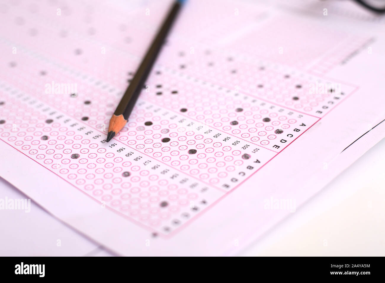 Picture of a man filling the OMR sheet Stock Photo - Alamy
