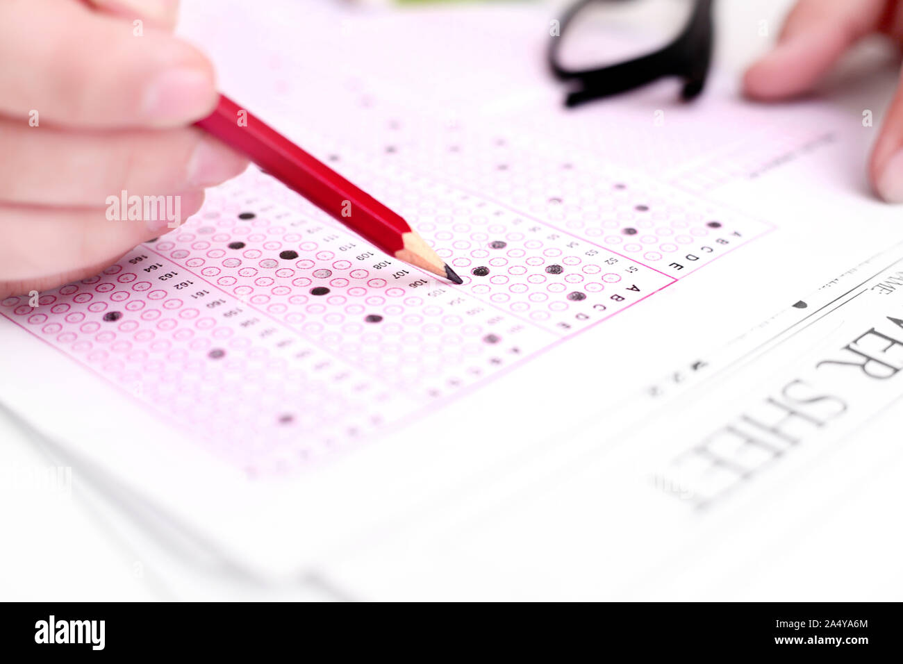 Picture of a man filling the OMR sheet Stock Photo - Alamy
