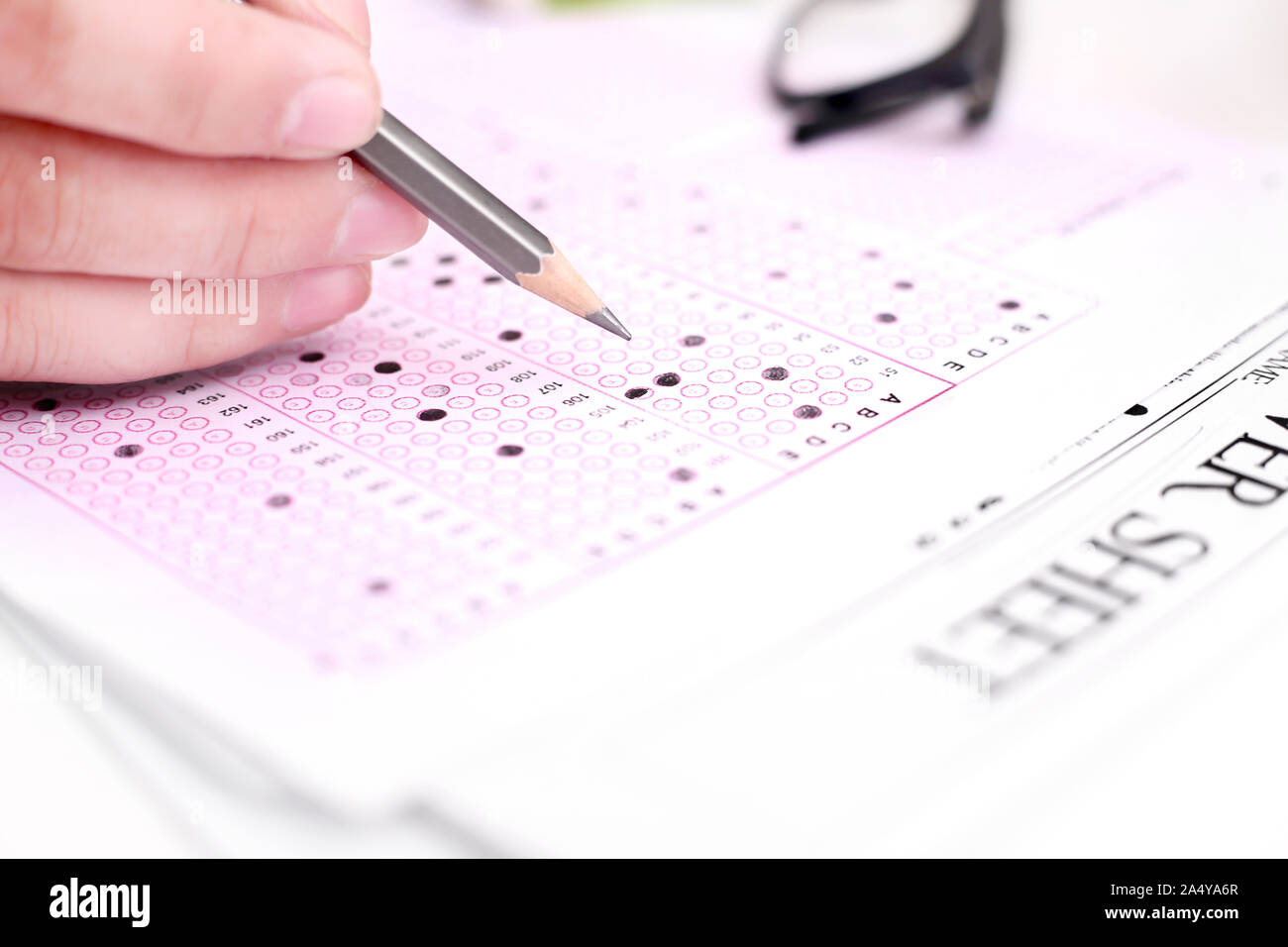 Picture of a man filling the OMR sheet Stock Photo - Alamy