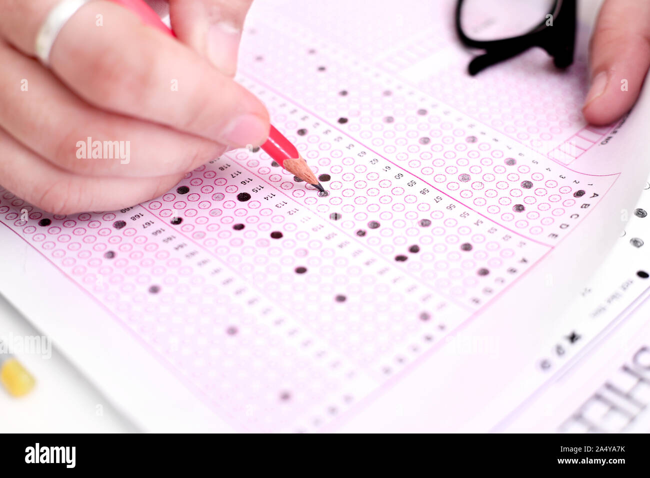 Picture of a man filling the OMR sheet Stock Photo - Alamy