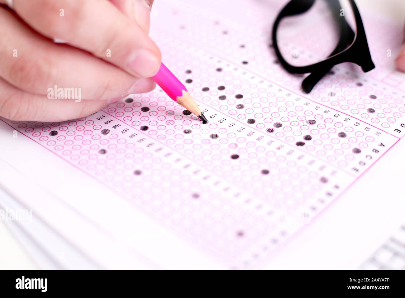 Picture of a man filling the OMR sheet Stock Photo - Alamy