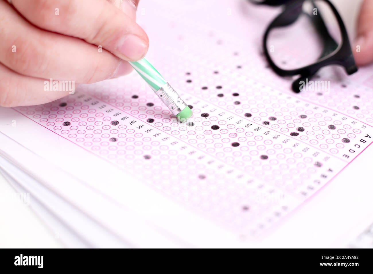 Picture of a man filling the OMR sheet Stock Photo - Alamy
