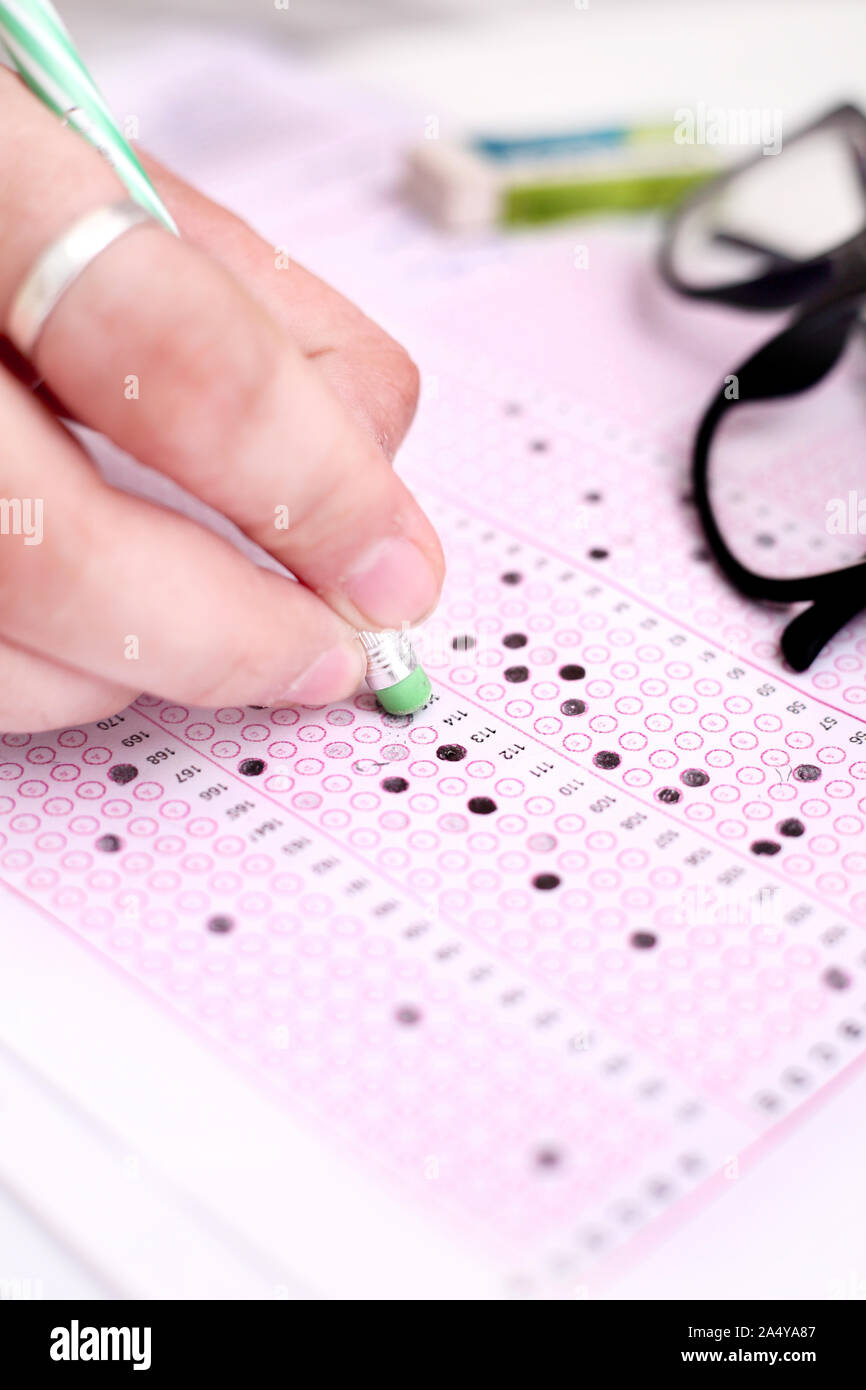 Picture of a man filling the OMR sheet Stock Photo - Alamy