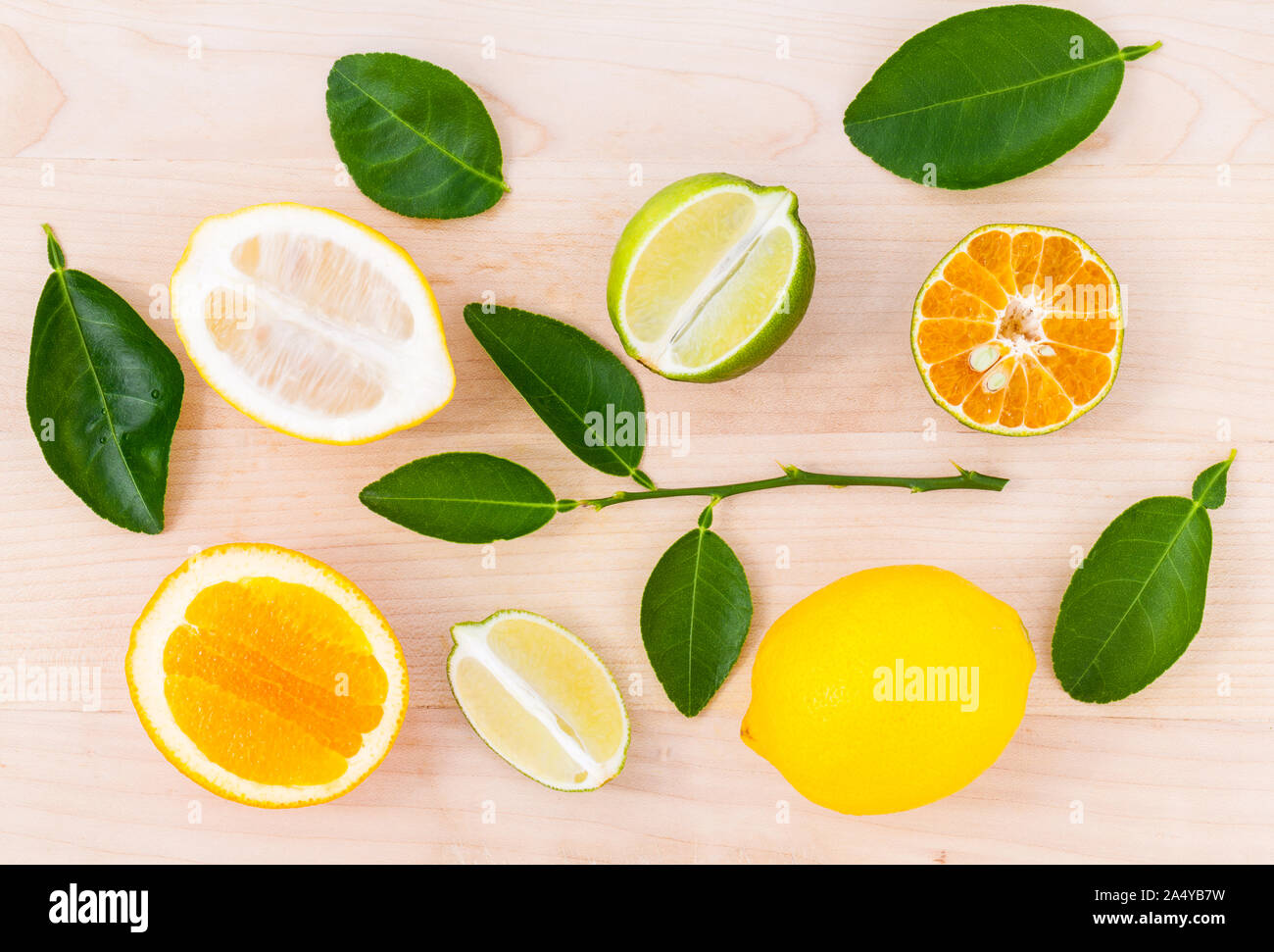 Mixed citruses fruit oranges, lemon and lime on wooden background with ...