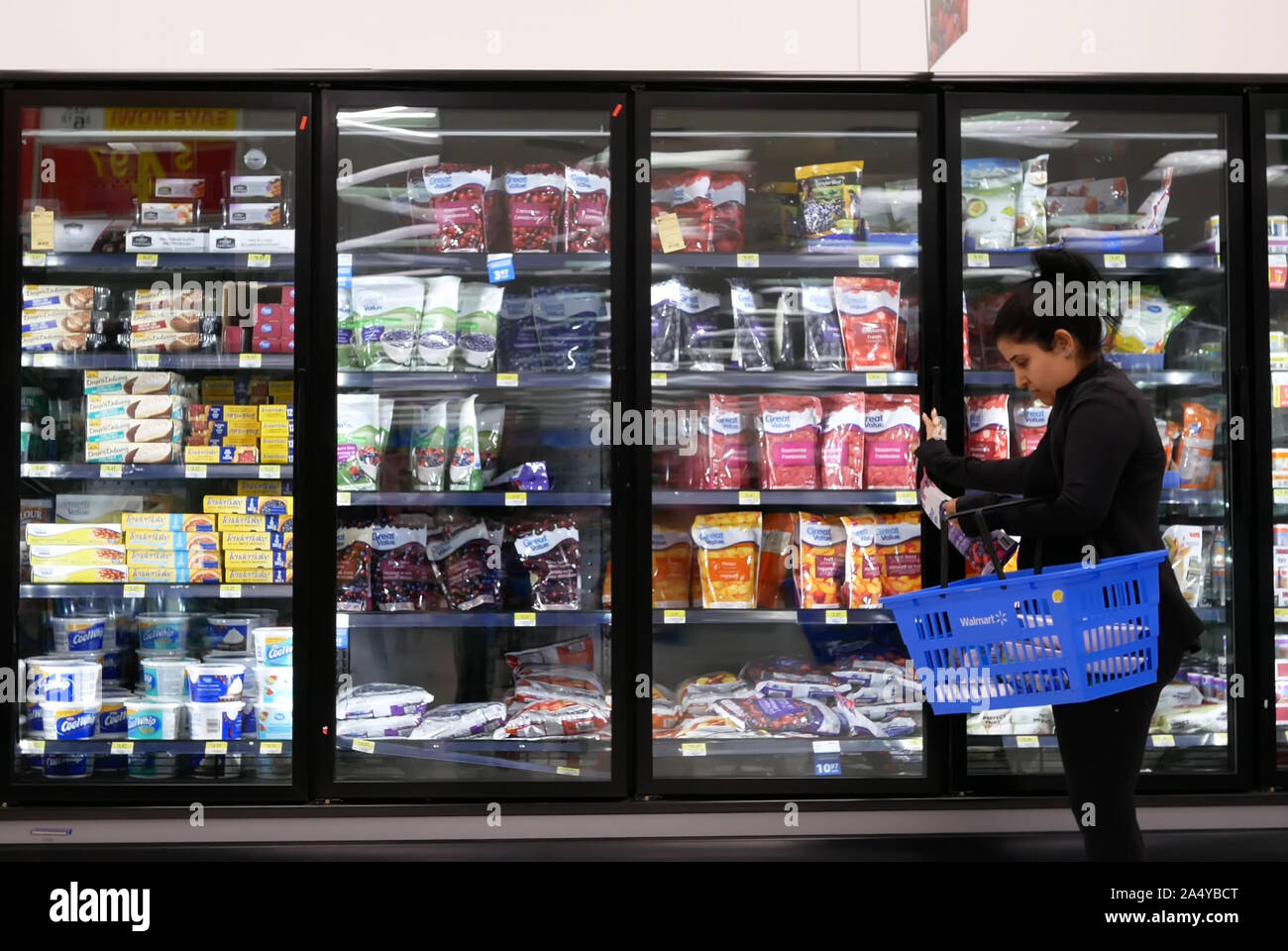 Motion of woman buying frozen fruits inside Walmart store Stock Photo ...
