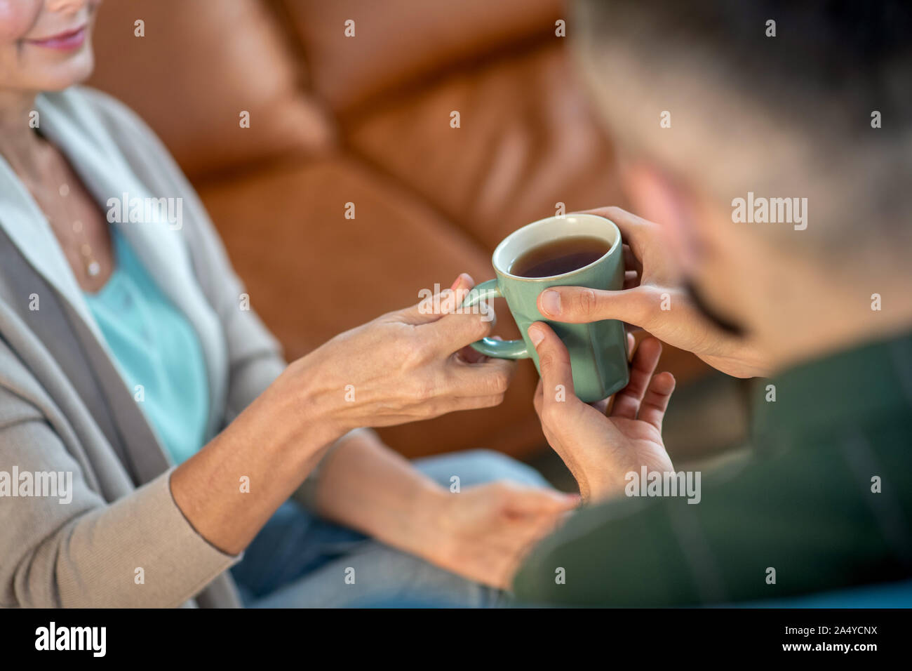 Psychoanalyst giving tea to her patient while having conversation Stock ...