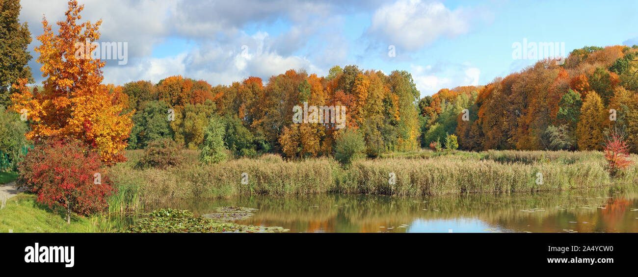 Autumn october sunny day panoramic European landscape with cold lake ...