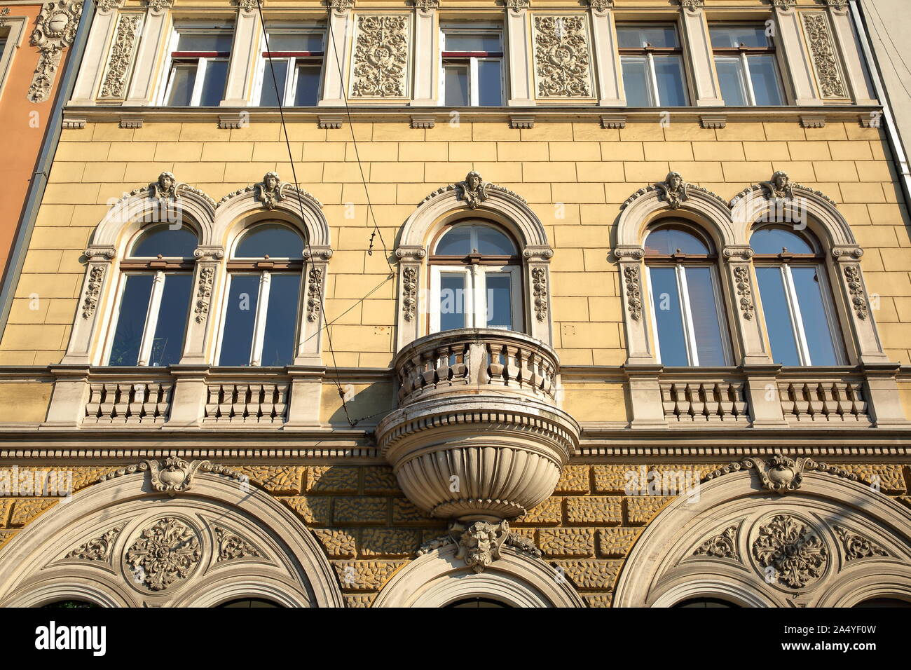 Colorful Austro-Hungarian buildings with carvings, located on the right ...