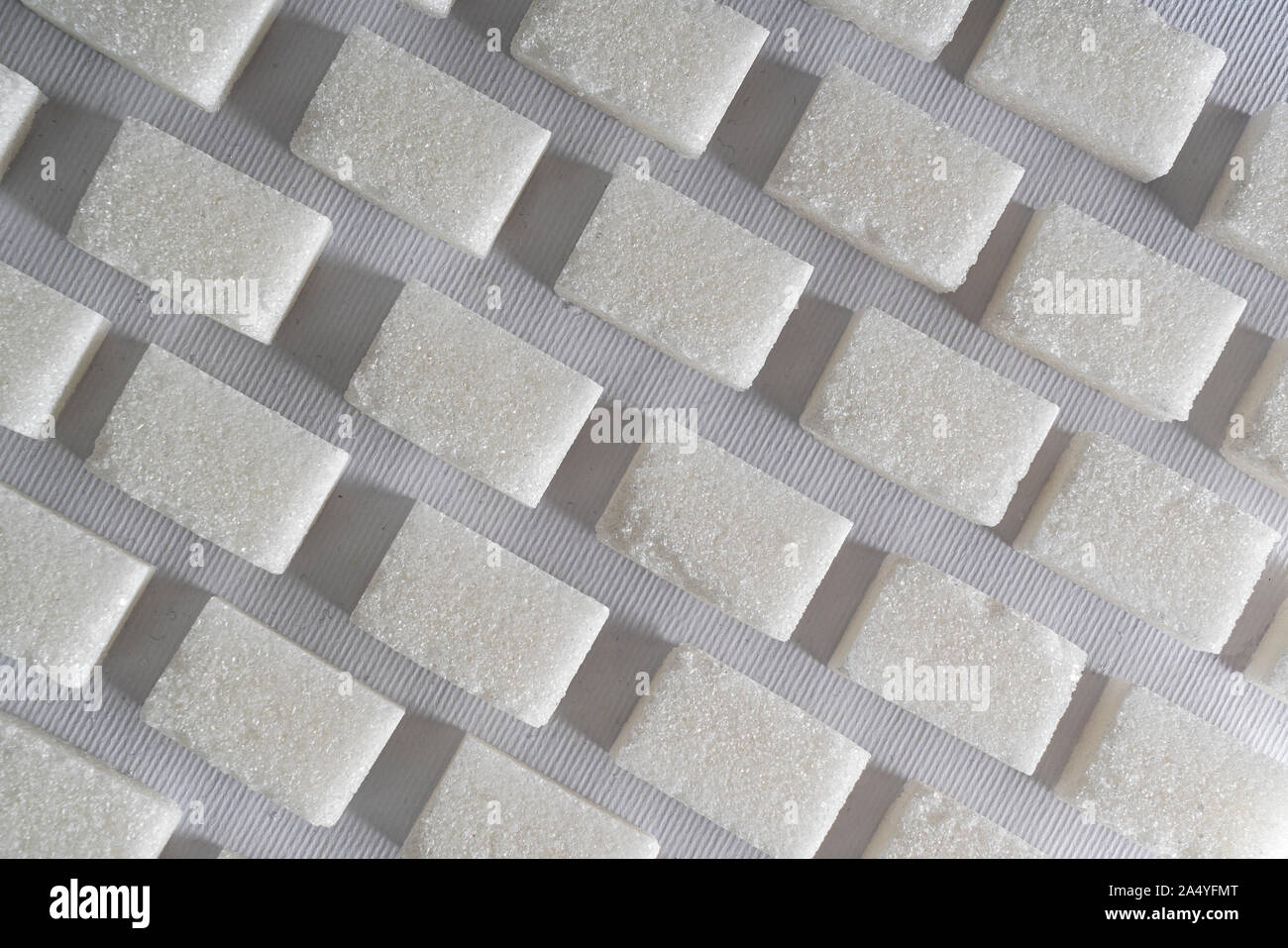 the background pattern formed with sugar cubes Stock Photo - Alamy