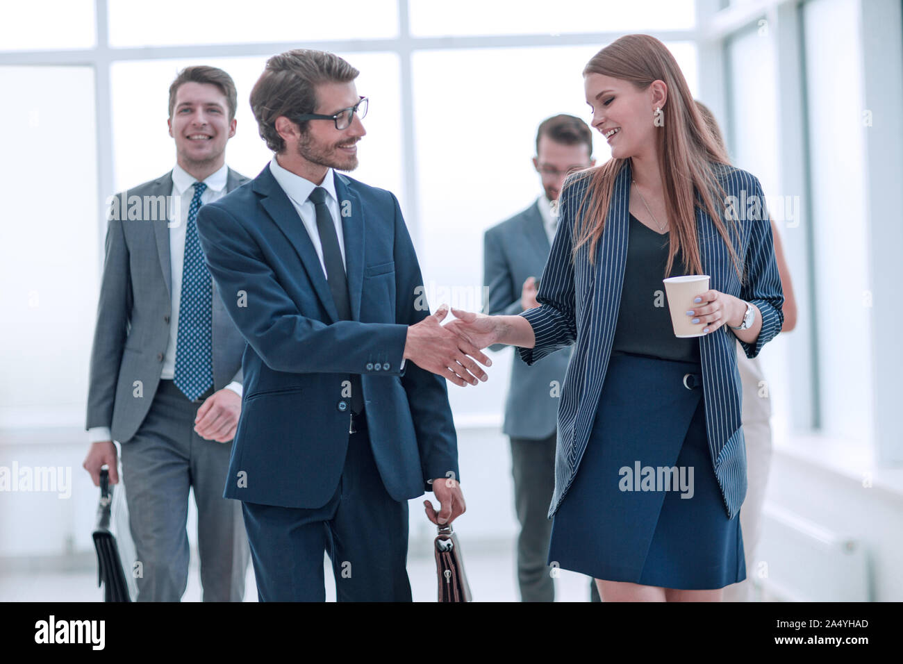 employer shaking hands with a young employee Stock Photo - Alamy