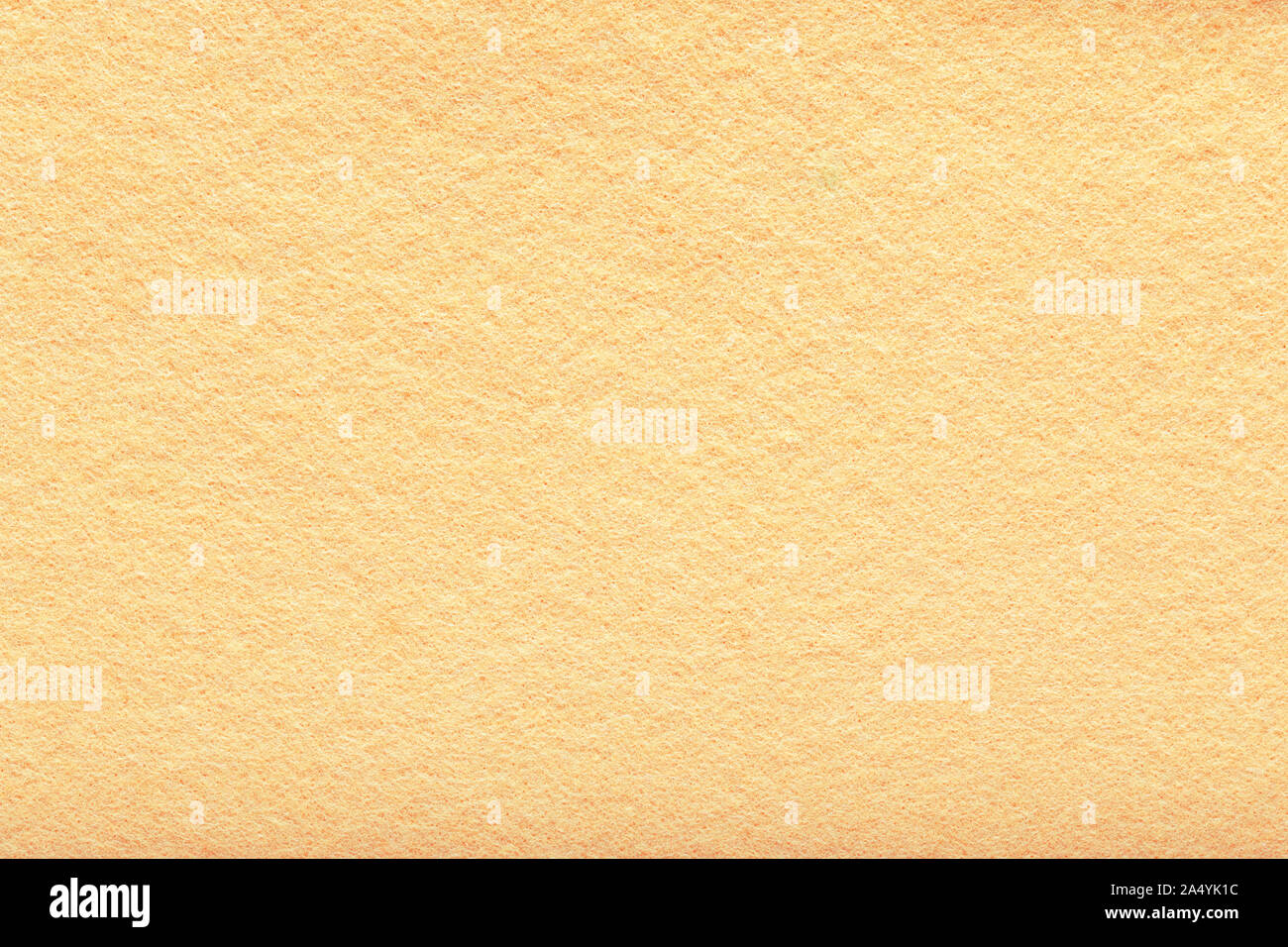 Fine grain yellow woolen felt. Texture background. Light yellow matte ...