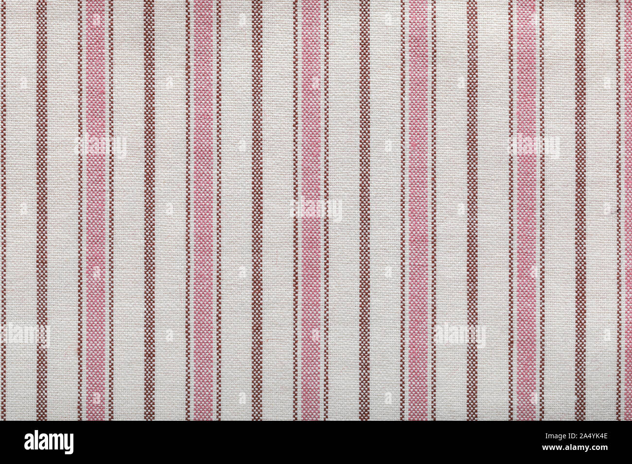 Colored striped coarse linen fabric texture closeup as background. a ...