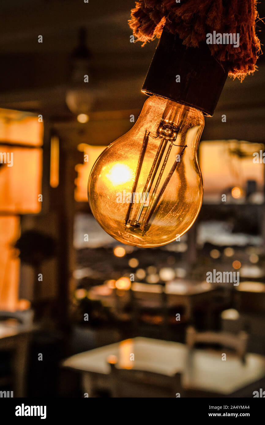 Lightbulb illuminated by candlelight hi-res stock photography and ...