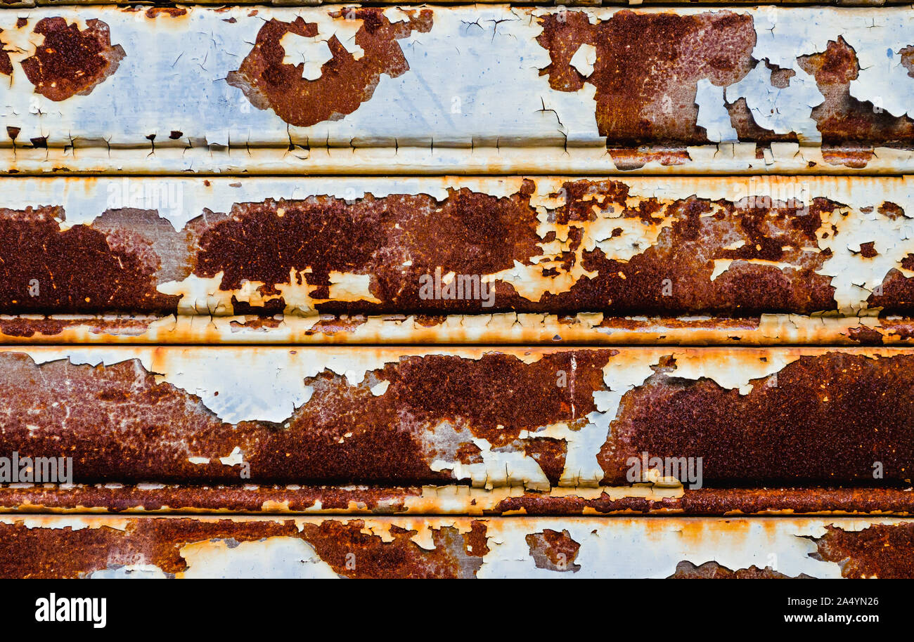 Old rusty textured metal rolling shutter closed with horizontal lines ...