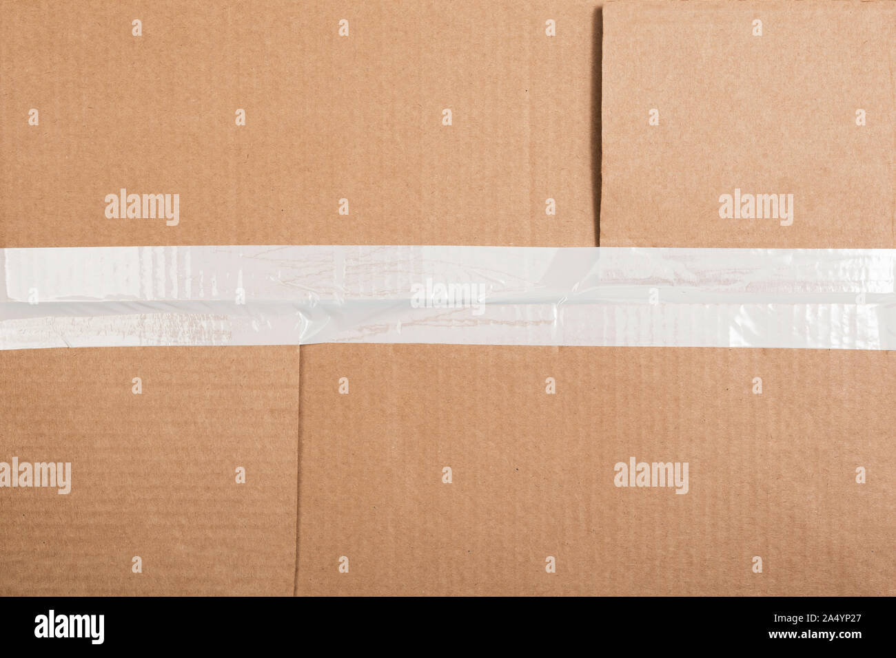 Cardboard box background with a sticky tape Stock Photo - Alamy