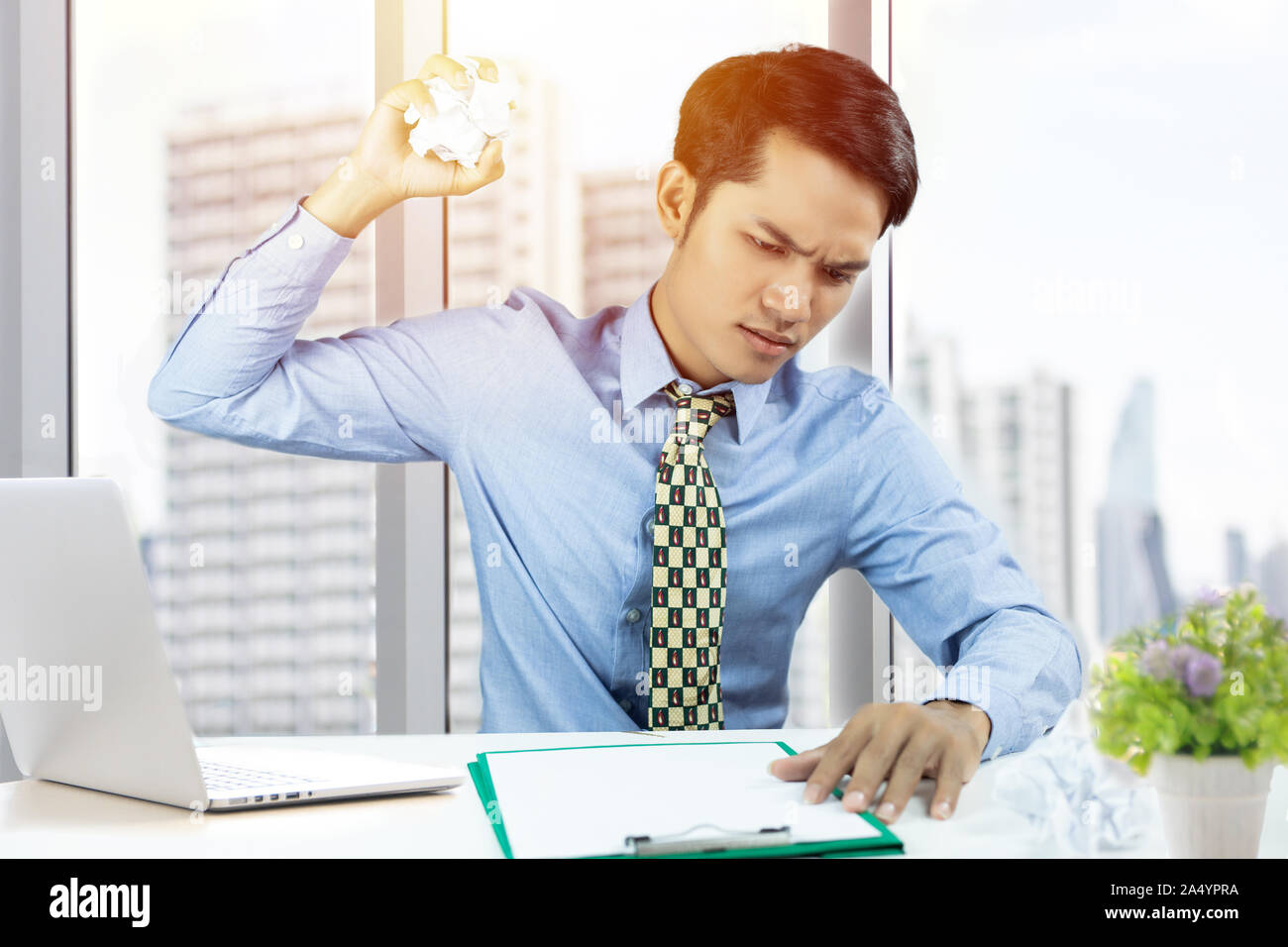 Asian business man throwing paper and serious about the work done until ...