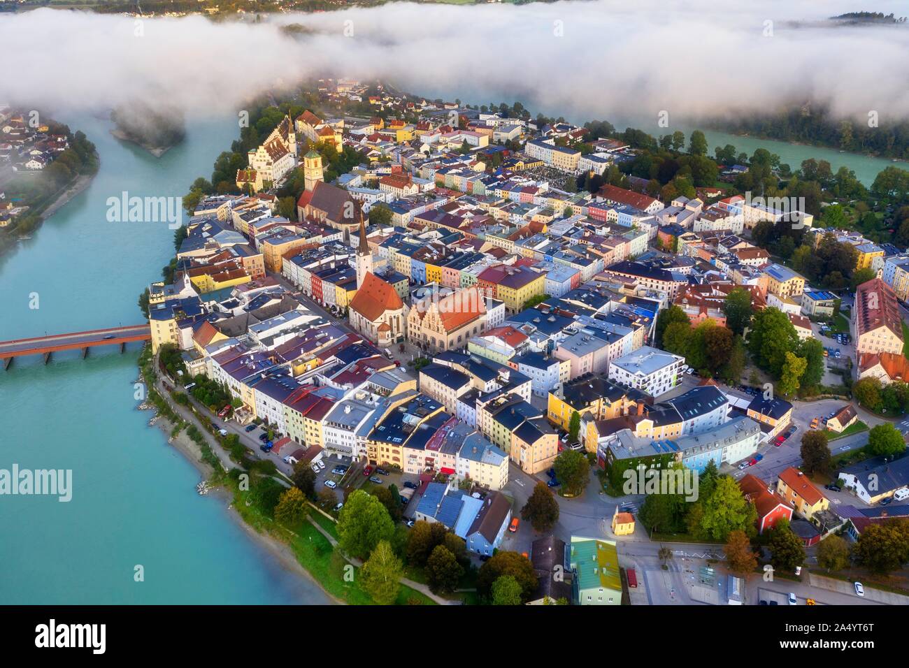 Old town in river loop of the Inn at sunrise, moated castle am Inn ...