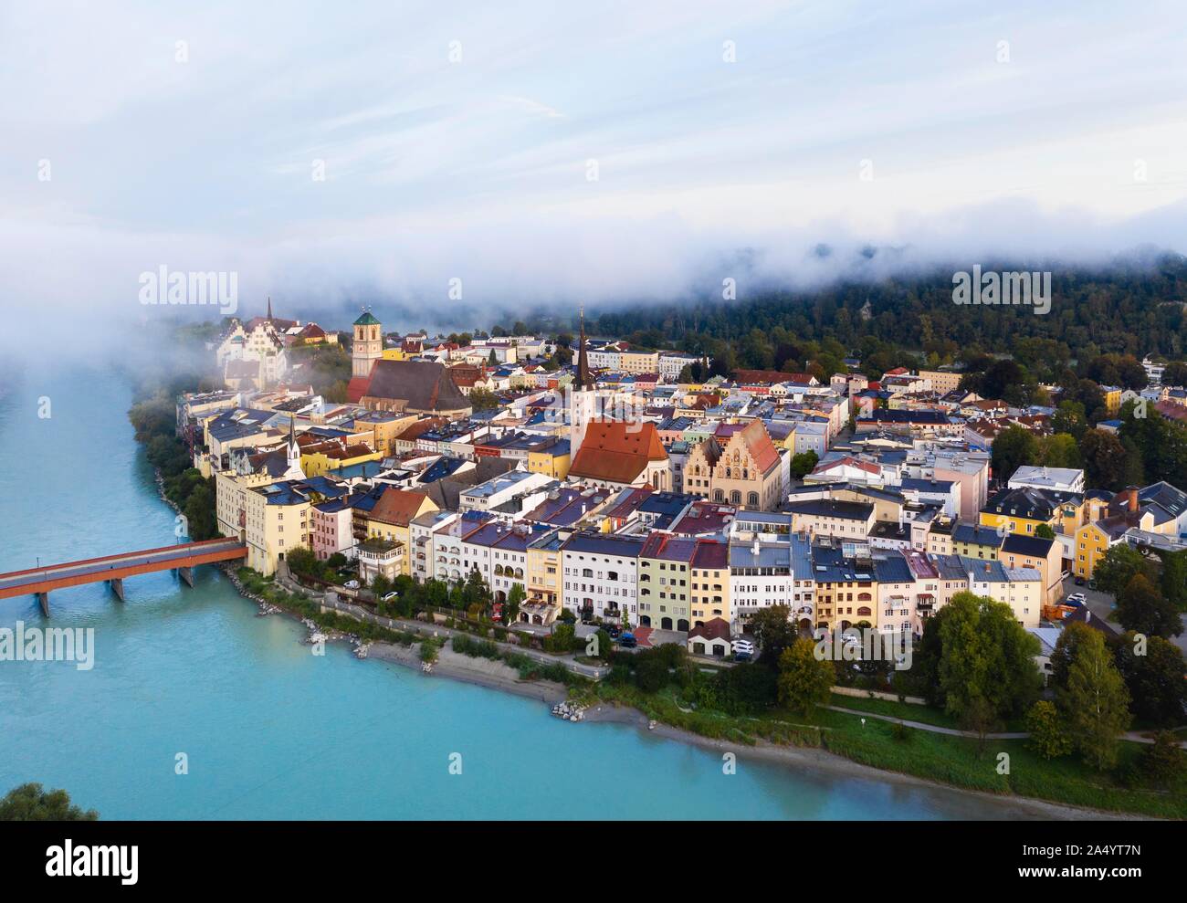 Old town at dawn and fog, moated castle am Inn, river Inn, aerial view ...