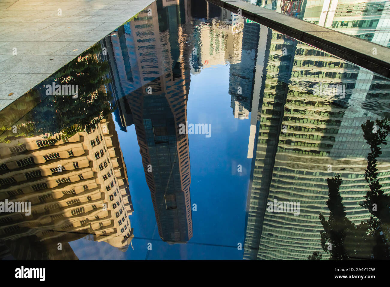 high tower buildings reflection in blue pool Stock Photo - Alamy