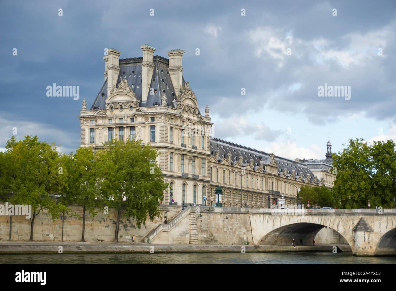 Exterior view of the facade of the Louvre, from the river Seine. Paris ...