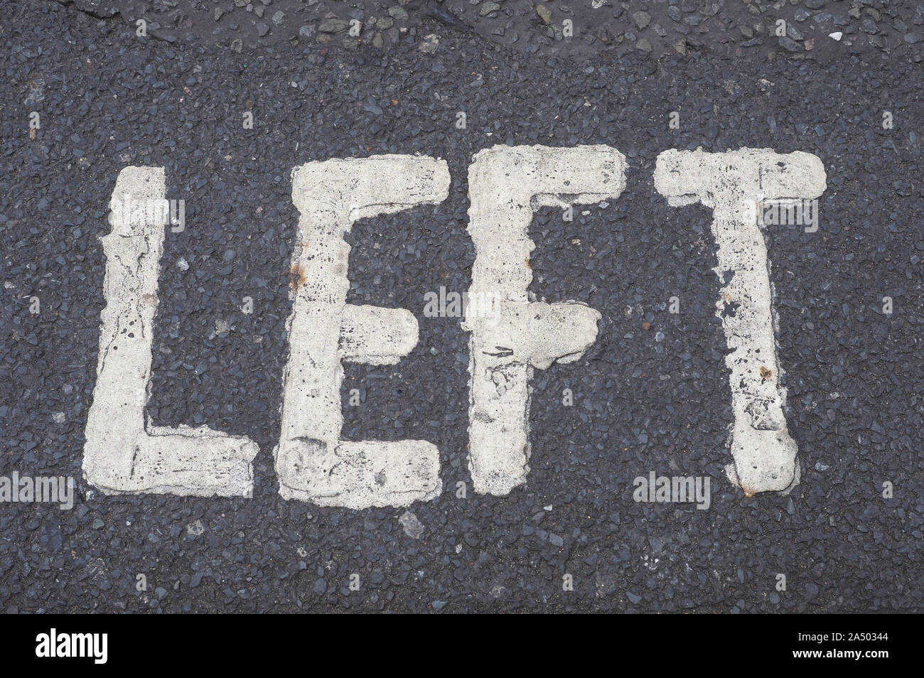 Look Left traffic sign on a London street tarmac Stock Photo - Alamy