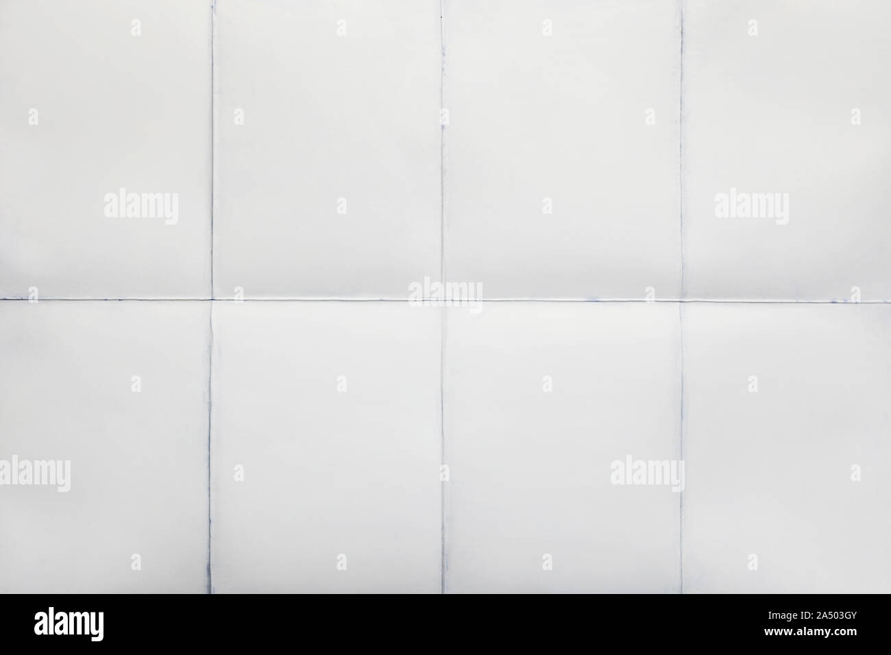 Empty sheet of paper folded in eight, white background Stock Photo - Alamy