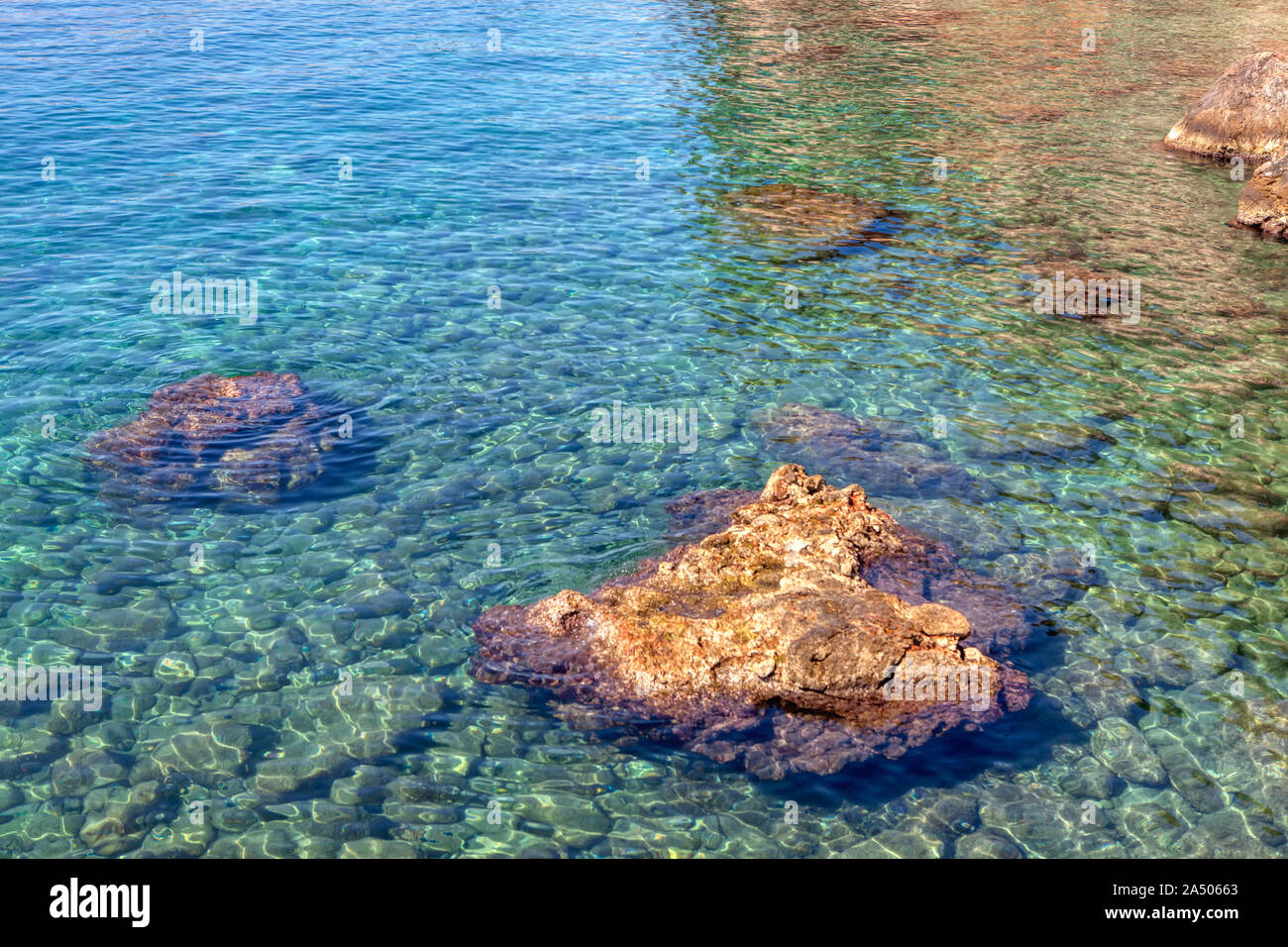 tropical transparent sea water with rocks Stock Photo - Alamy