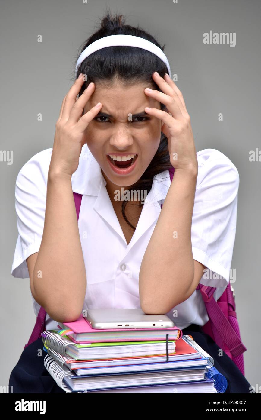 Anxious Girl Student Wearing School Uniform With Books Stock Photo - Alamy