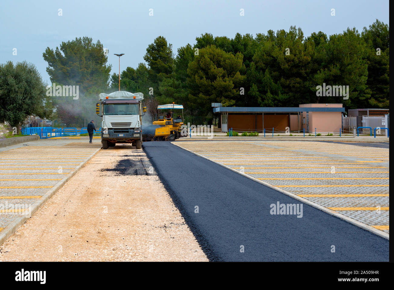 Asphalt paver with asphalt heated to temperatures above 160 ° during ...