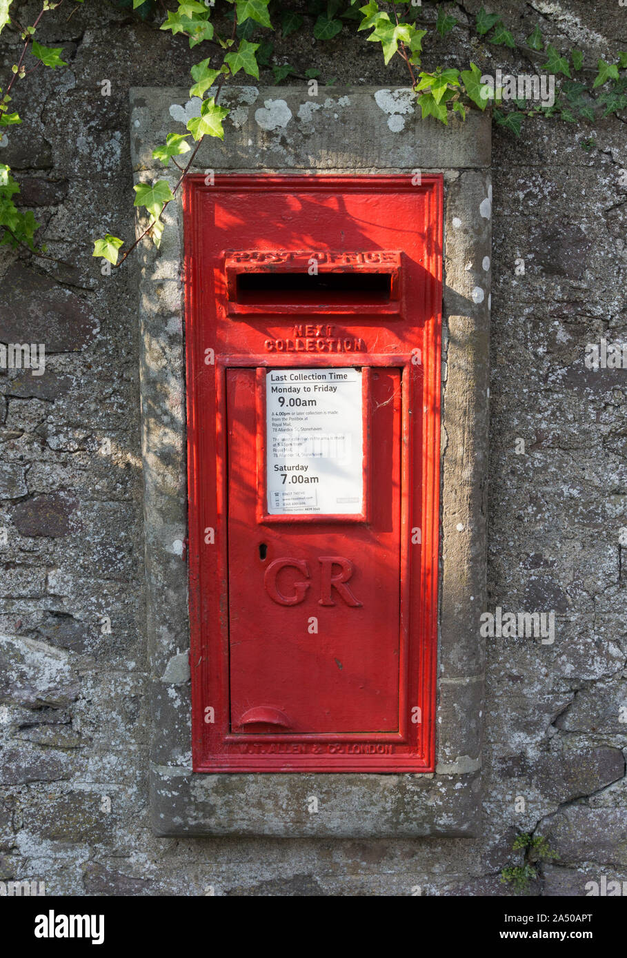 Red british post box in a city street hi-res stock photography and ...