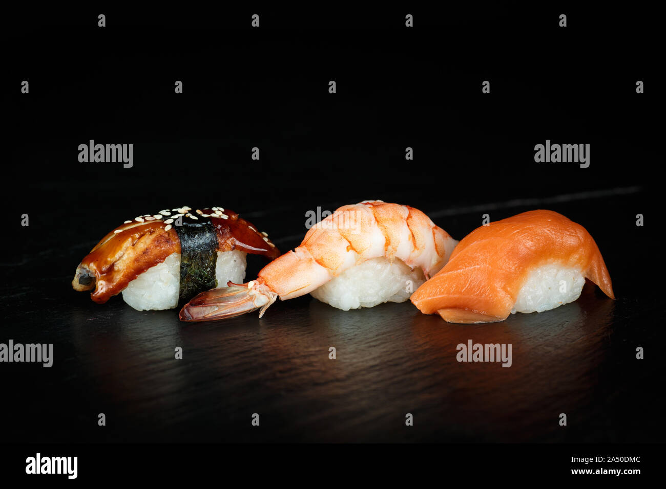 assorted sushi shake, unagi, ebi close-up on a black background Stock ...