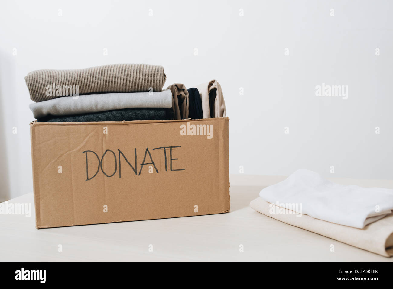 clothes in box for concept donation and reuse recycle Stock Photo - Alamy