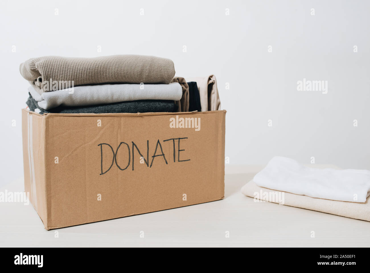 clothes in box for concept donation and reuse recycle Stock Photo - Alamy