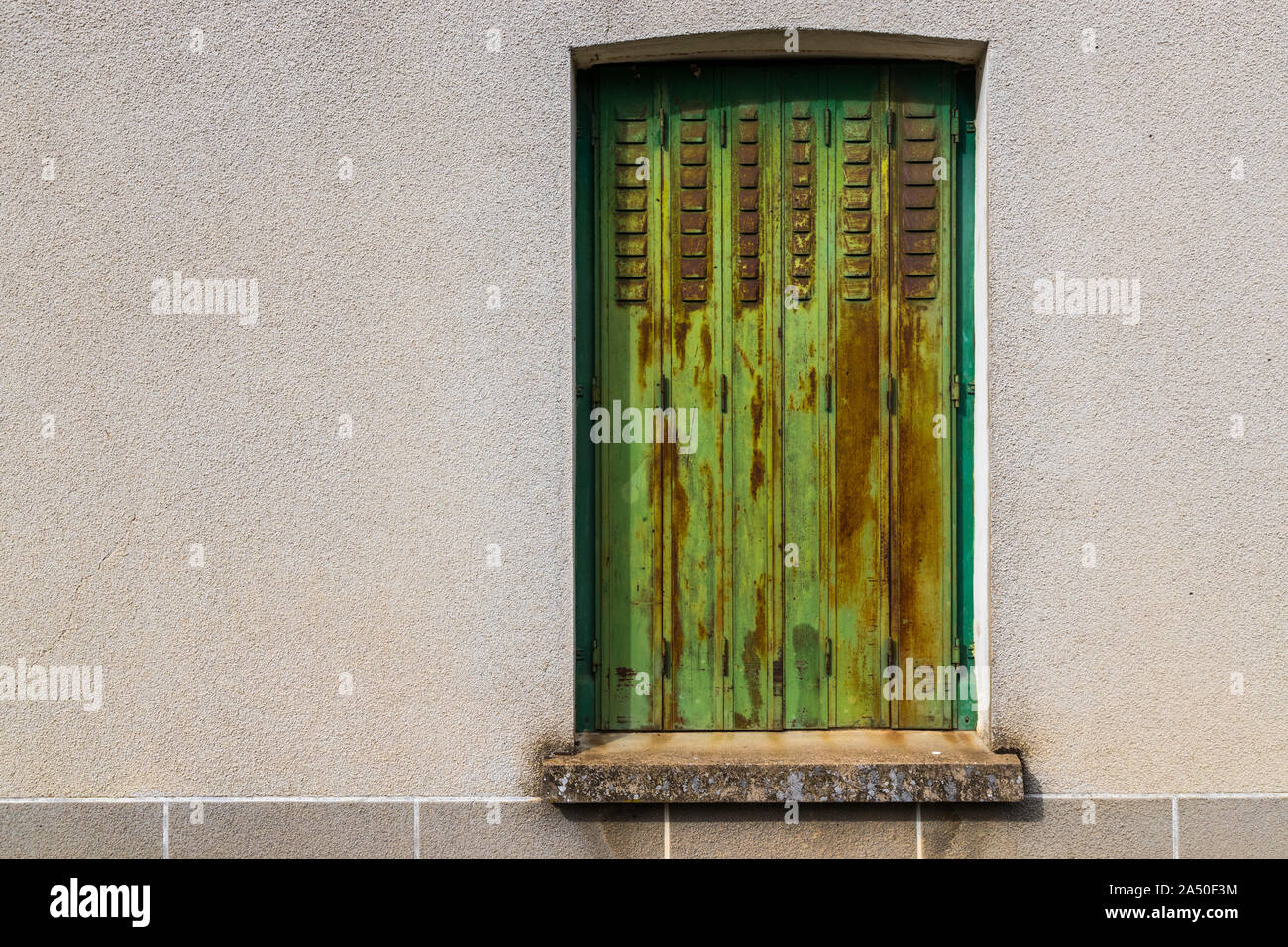 old green rusty metal window shutters background Stock Photo - Alamy