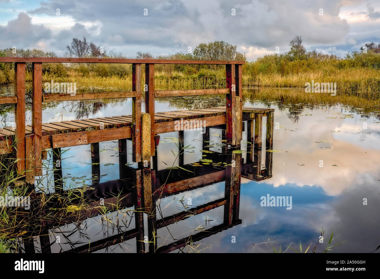 wooden bridge over the river Stock Photo - Alamy