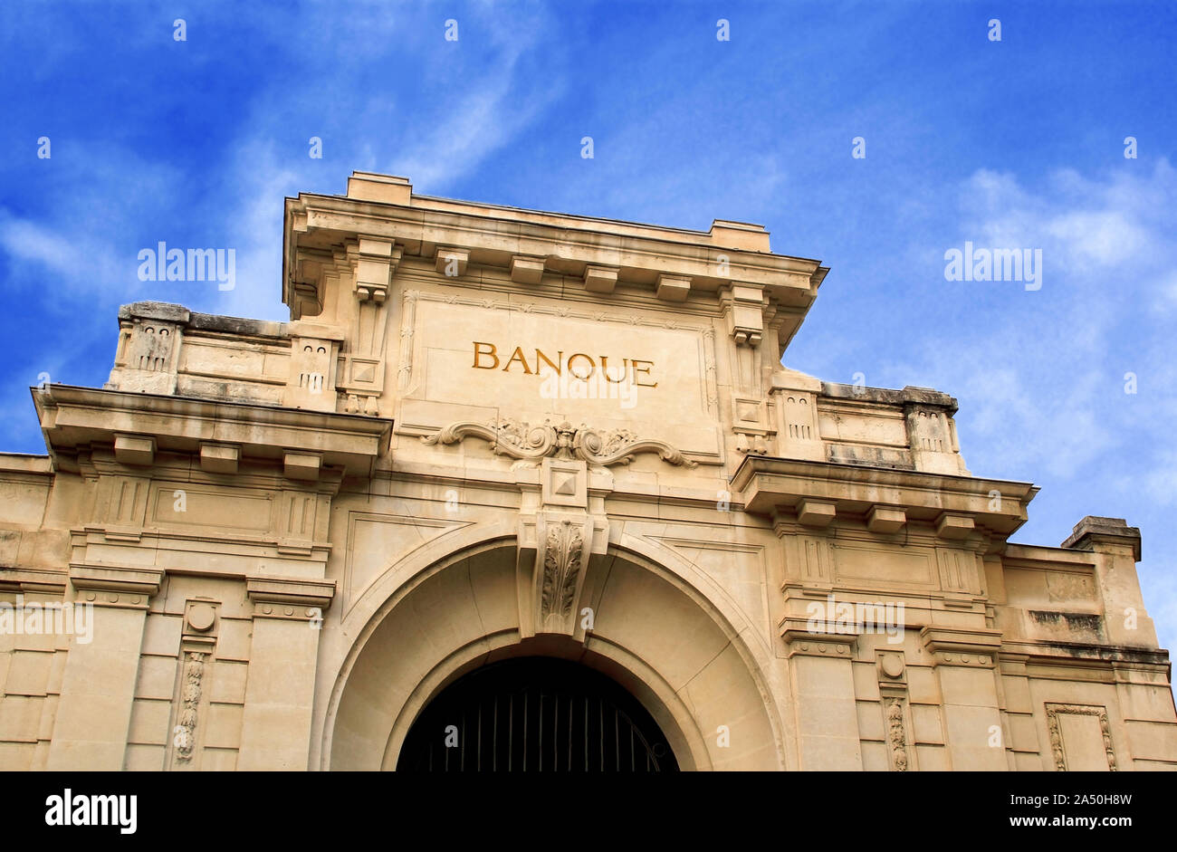 Inscription on the pediment of a stone building indicating a bank Stock ...