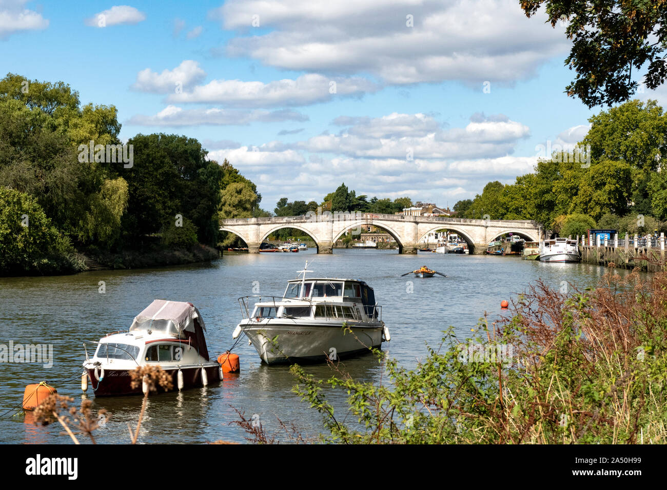 Richmond Bridge across the River Thames in the summer, with pleasure ...