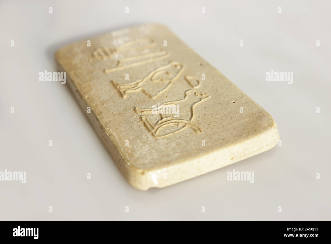 clay tablet with the inscription cat in ancient egyptian. modern ...