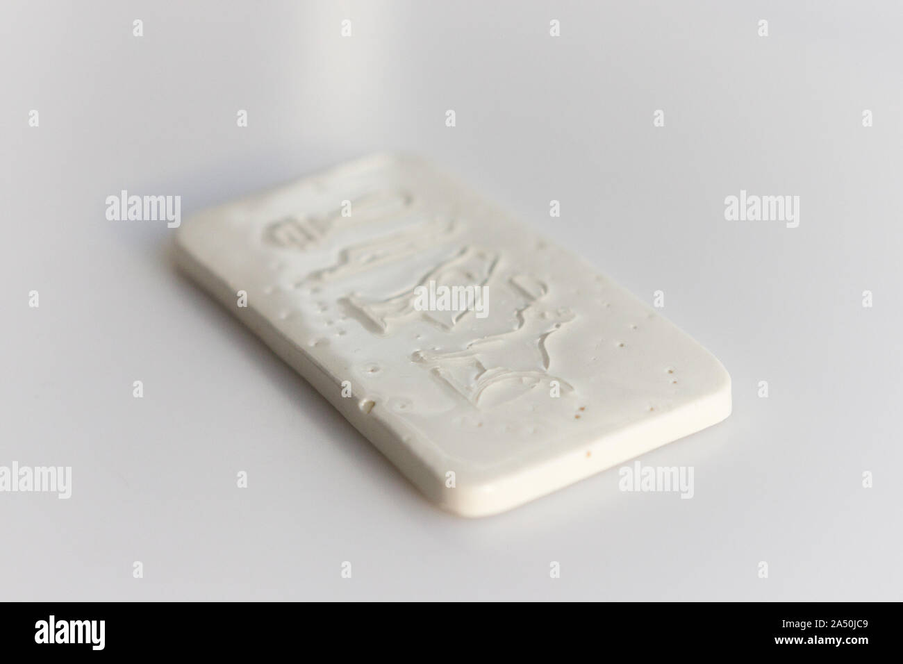 clay tablet with the inscription cat in ancient egyptian. modern ...