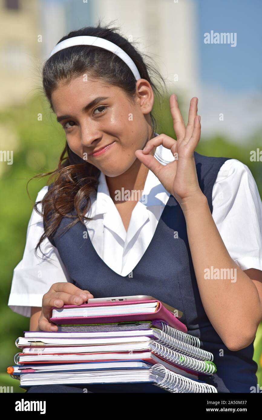 Okay Catholic Colombian Person With Notebooks Stock Photo - Alamy