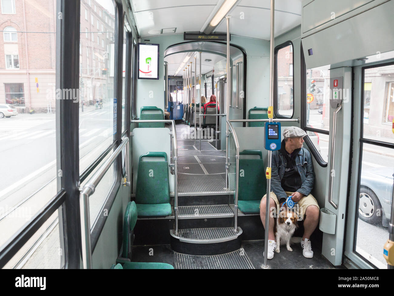 HELSINKI, FINLAND - MAY 23, 2019: Tram interior. An unidentified man ...