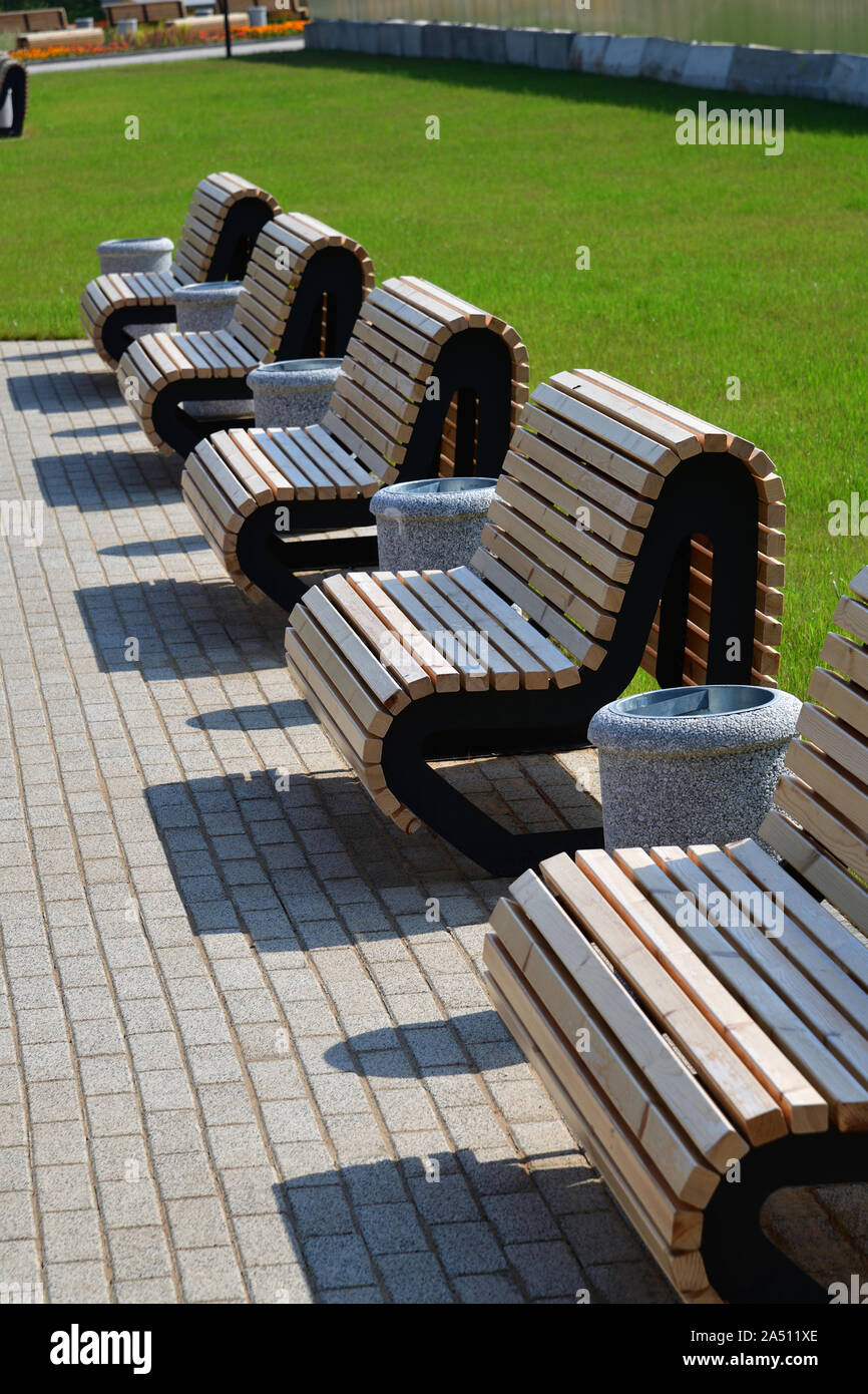 Beautiful wooden benches in a city park in Moscow, Russia Stock Photo ...
