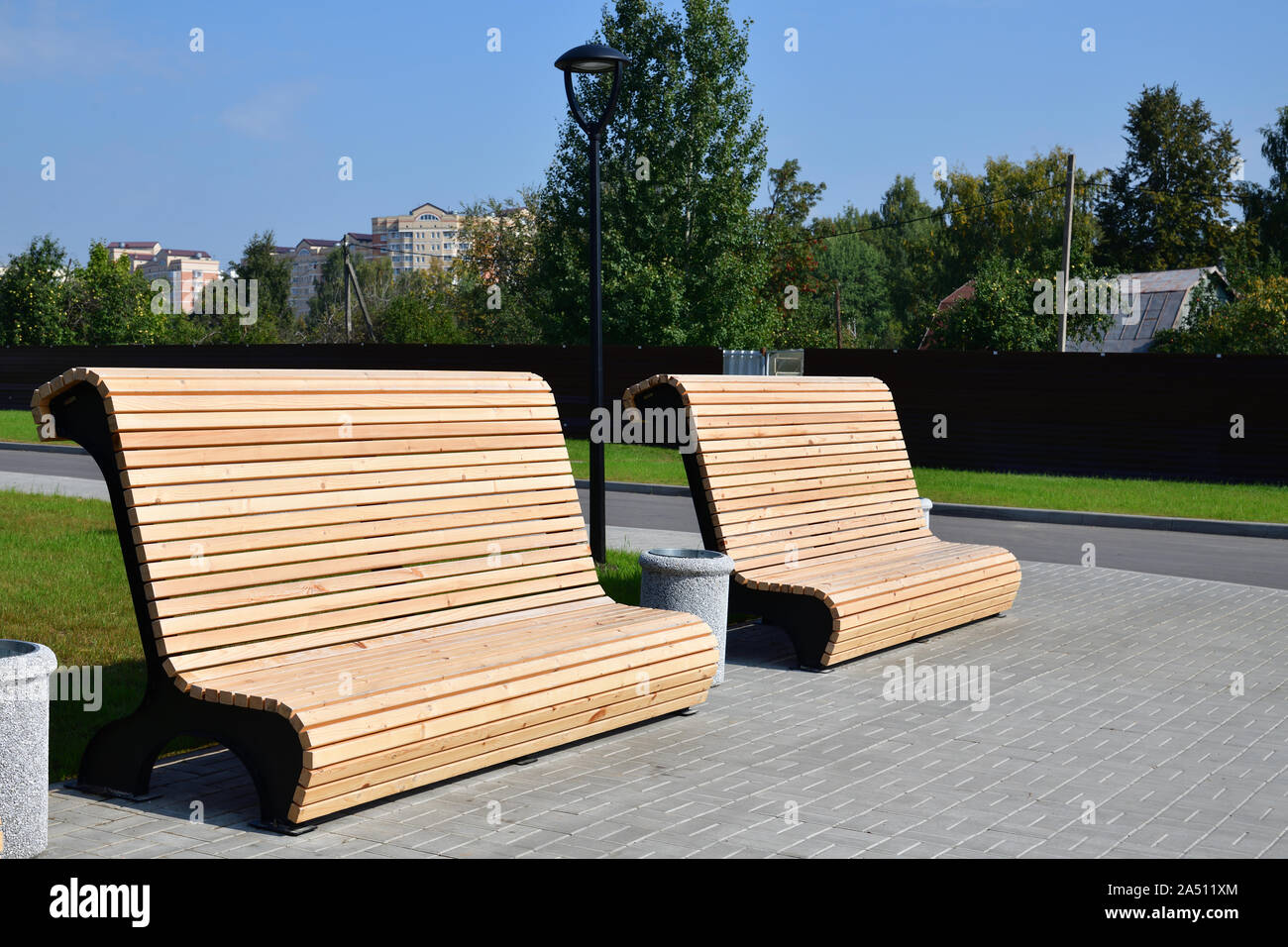 Beautiful wooden benches in a city park in Moscow, Russia Stock Photo ...