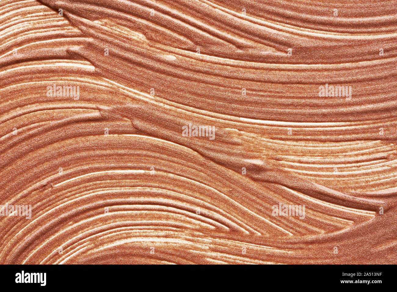 Soft gold texture and strokes of face highlighter or acrylic paint ...