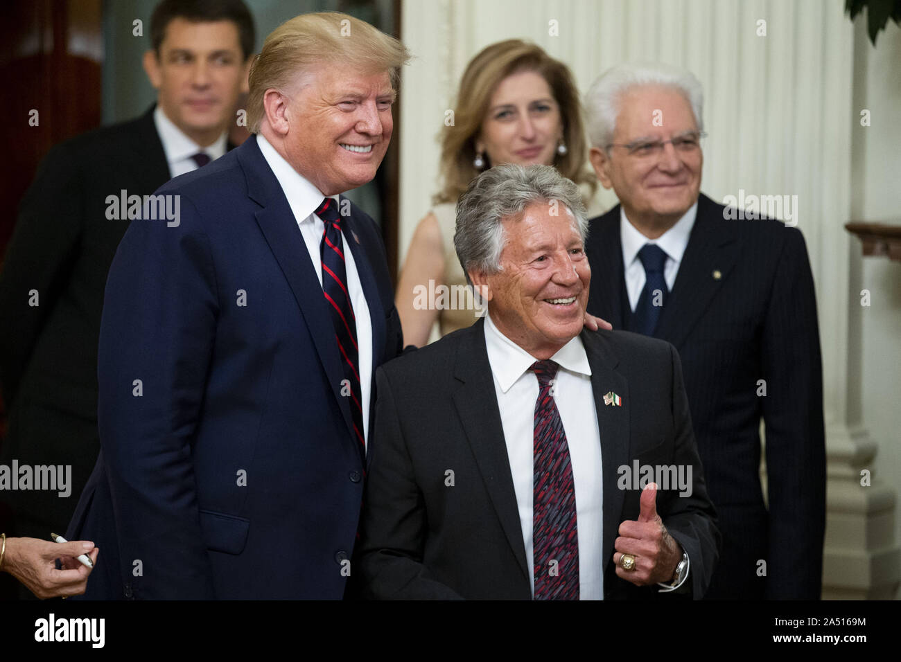 President Donald Trump (L) poses for a picture with Italian-born ...
