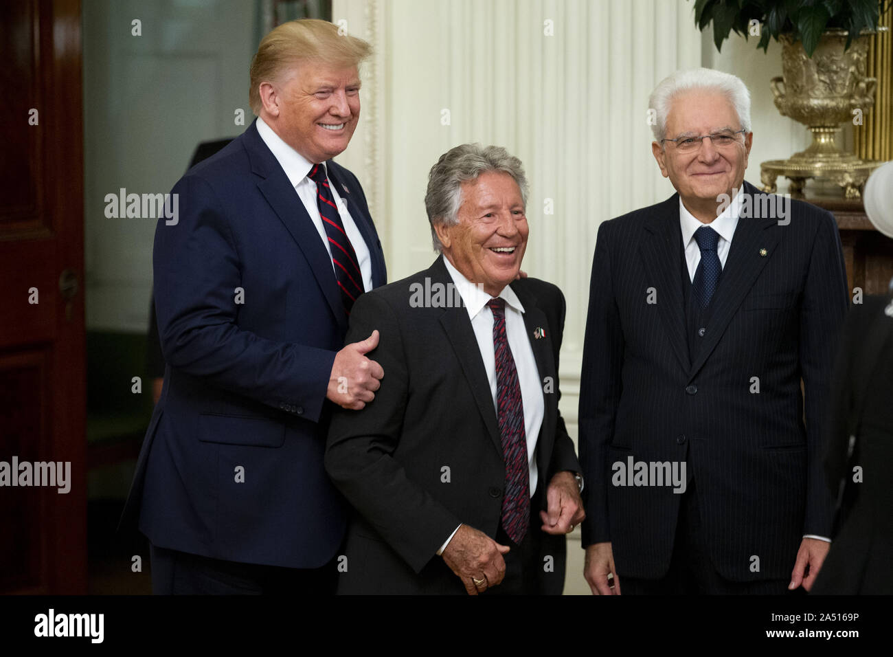 President Donald Trump (L) poses for a picture with Italian-born ...