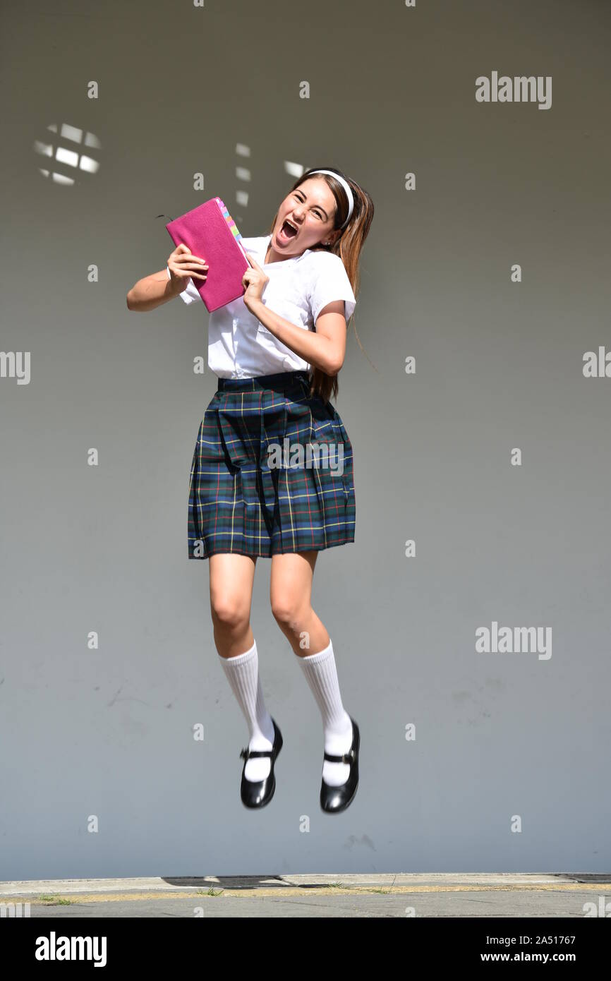 Happy Excited Student Female Jumping Stock Photo - Alamy