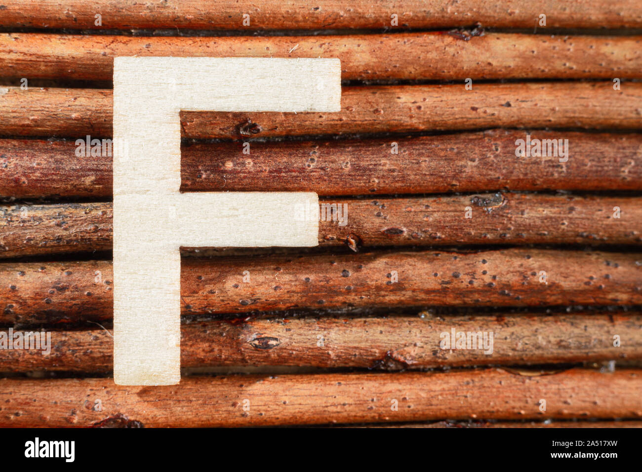 Letter F of wood-made alphabet, top view and space for text Stock Photo ...
