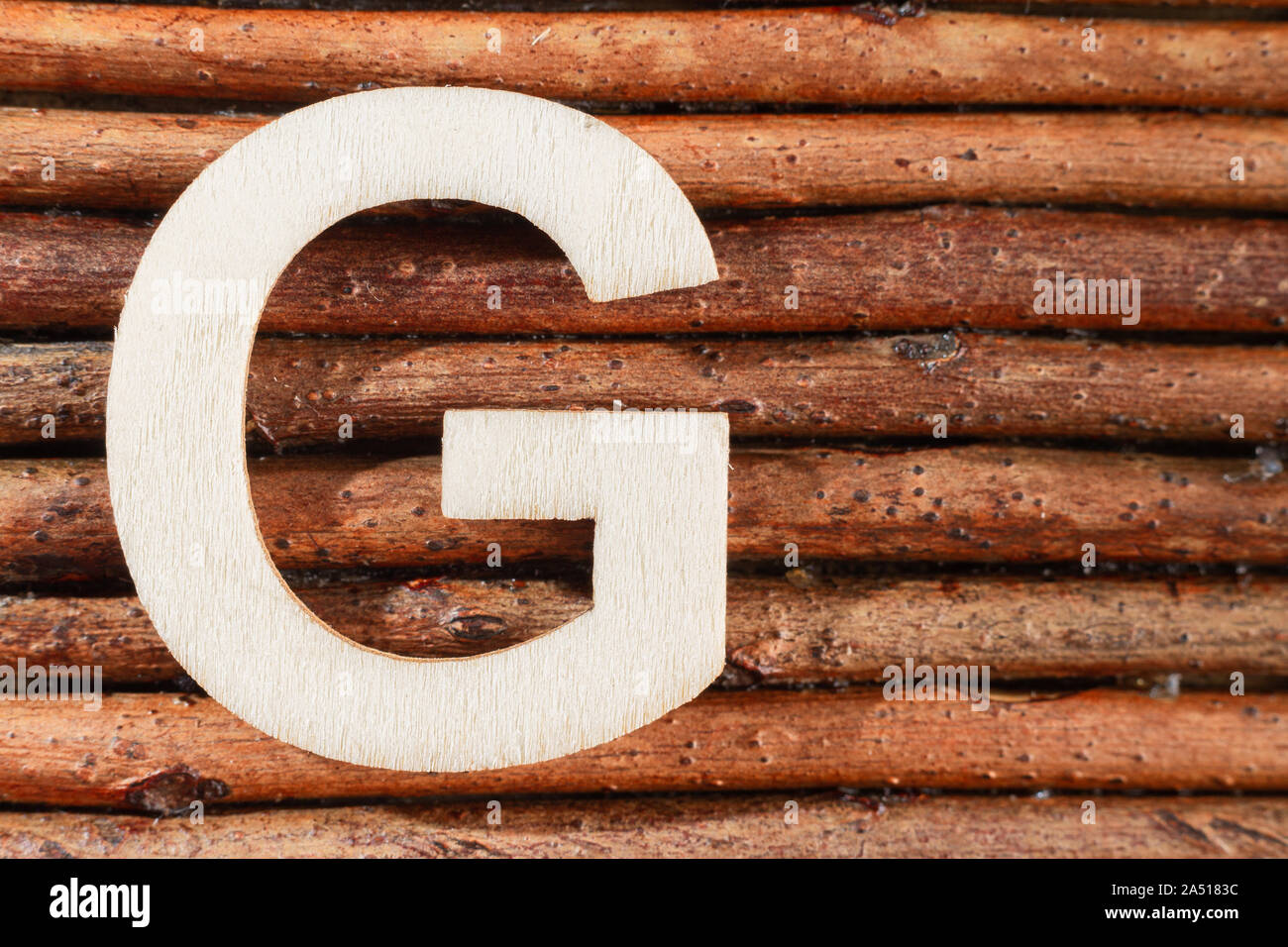 Letter G of wood-made alphabet, top view and space for text Stock Photo ...